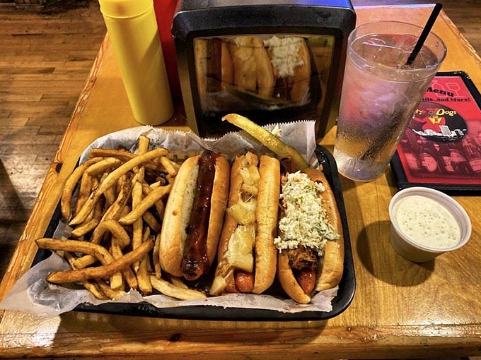 Two hot dogs nestled in their basket like old friends catching up &ndash; one with coleslaw telling stories to the other slathered in mustard.