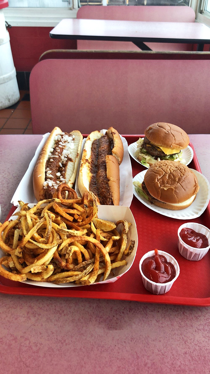 Two perfectly imperfect burgers flanked by footlongs and curly fries&mdash;a red tray of happiness that makes dieting seem like a concept from another dimension.
