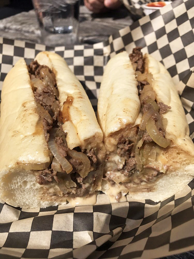 Behold the pepper cheesesteak in all its glory – where thinly sliced ribeye meets its destiny with caramelized onions and those vibrant green peppers.