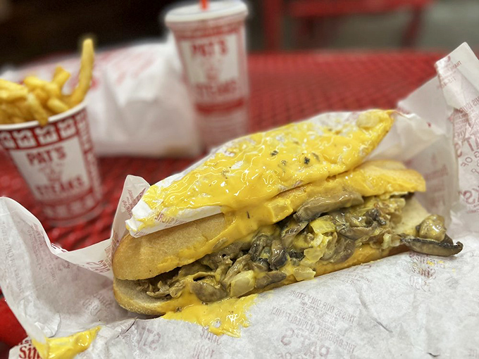 Behold the golden glory! This "whiz wit" masterpiece showcases the perfect marriage of thinly sliced beef and molten cheese that Philadelphia built its reputation on.
