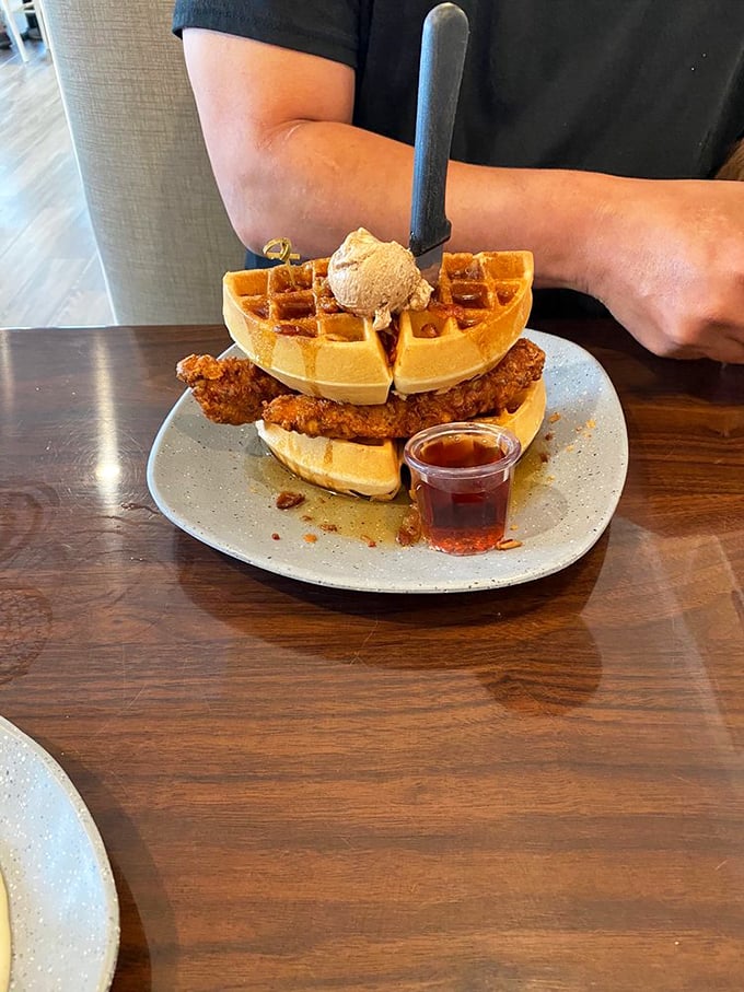 Chicken and waffles: where sweet meets savory in a dance so perfect it deserves its own Broadway show. That scoop of butter is the standing ovation.