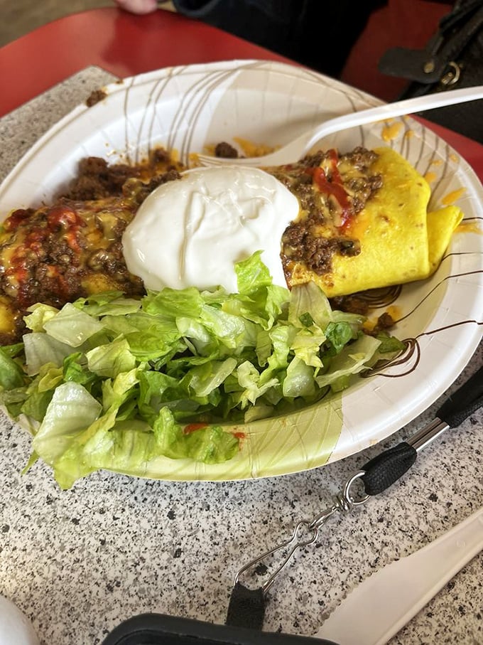 This Chili and Beans burrito doesn't need fancy plating to impress. The dollop of sour cream melting into that seasoned beef tells the whole delicious story.