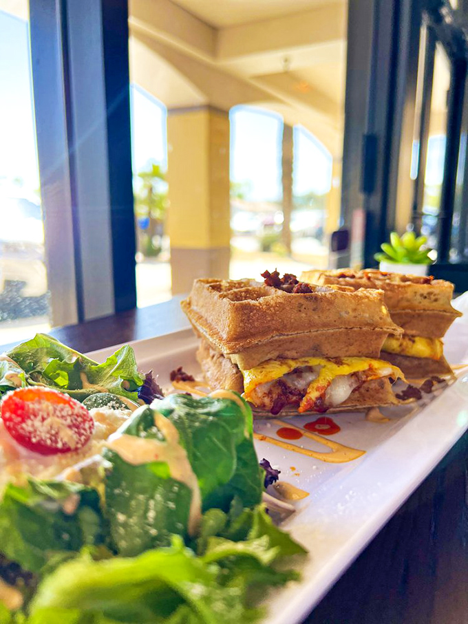 Breakfast rebellion at its finest: a savory waffle sandwich stuffed with eggs and cheese, proving waffles were never meant to be pigeonholed as just sweet treats.