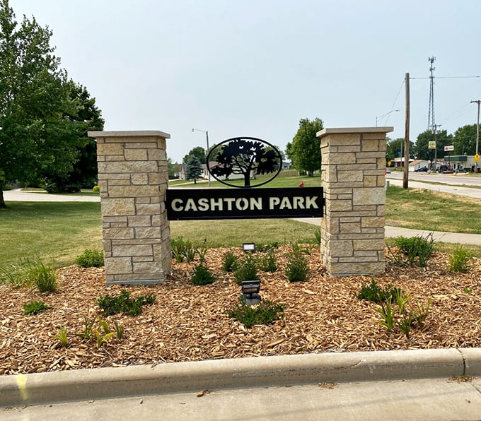 Morning mist embraces a classic red barn at sunrise, creating the kind of scene that makes city dwellers question their life choices.
