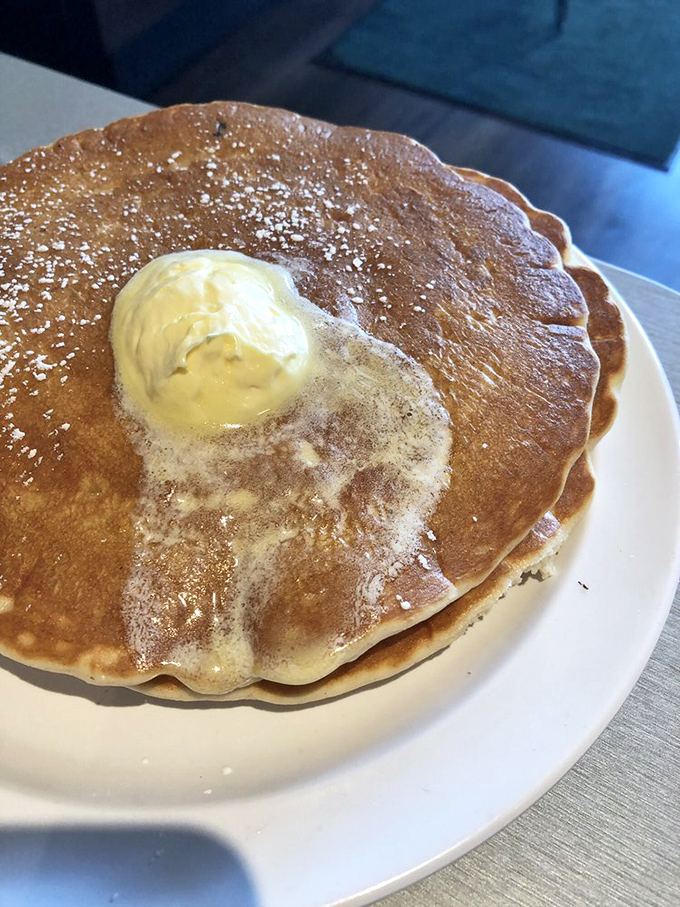 Golden-brown perfection with a melting pat of butter that's performing its own little sunrise ceremony. Breakfast doesn't get more iconic than this.
