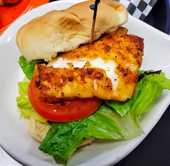 Behold the star of our show: golden-crusted fish perched on fresh lettuce and tomato. This sandwich doesn't need fancy plating&mdash;it's the Meryl Streep of seafood.