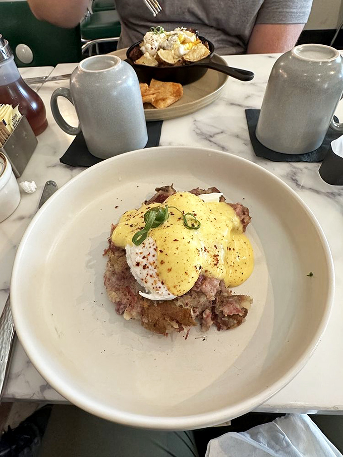 This isn't just breakfast, it's edible architecture&mdash;layers of corned beef hash crowned with hollandaise and a perfectly poached egg.