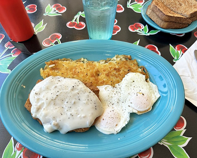 Country fried steak nirvana: golden-crisp coating, tender meat, and gravy that could make a vegetarian question their life choices. The hashbrowns aren't just a side&mdash;they're a statement. 