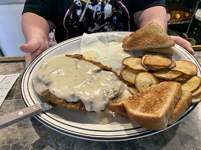 The country fried steak at Dee's doesn't just arrive on your plate&mdash;it commands attention with a golden crust that crackles with promise and enough gravy to make your cardiologist file for divorce. 