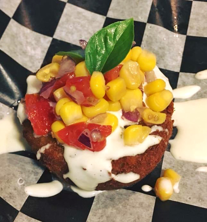 The star of the show: a perfectly golden crab cake topped with corn salsa and a drizzle of sauce that makes you want to high-five the chef.