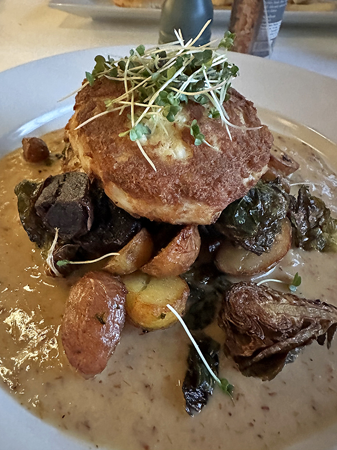 Golden-crusted perfection that makes conversation stop mid-sentence. This crab cake deserves its own moment of silent appreciation.