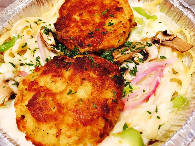 Golden-brown perfection! These crab cakes are what food dreams are made of&mdash;minimal filler, maximum flavor, served with pasta that's clearly not an afterthought.