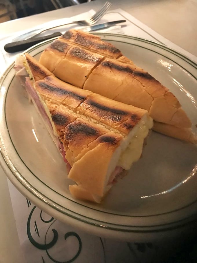 The Cuban sandwich at Versailles isn't just pressed&mdash;it's transformed into a crispy, melty masterpiece that makes other sandwiches question their life choices.