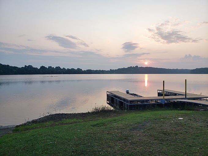 Sunset casts its golden spell across the water, turning a simple wooden dock into front-row seats to nature's evening show.