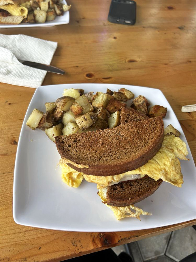 Breakfast perfection doesn't need fancy plating&mdash;just a hearty egg sandwich on toasted bread with perfectly seasoned potatoes that would make any morning person out of you.