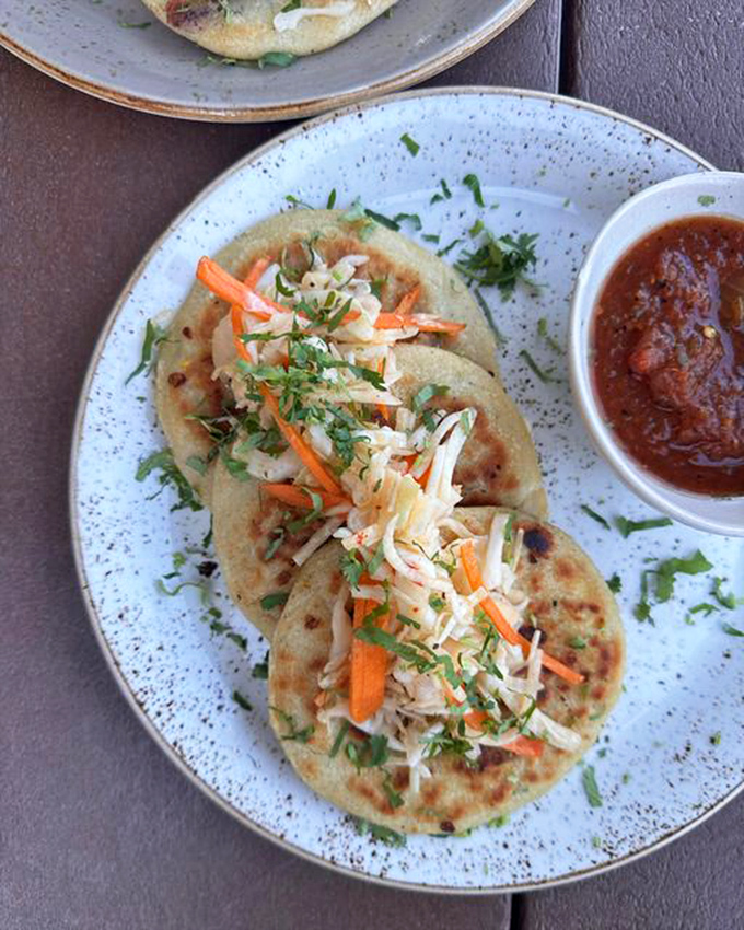 These aren't just fish tacos—they're edible masterpieces where perfectly seasoned fish meets fresh slaw in a tortilla that deserves its own fan club.