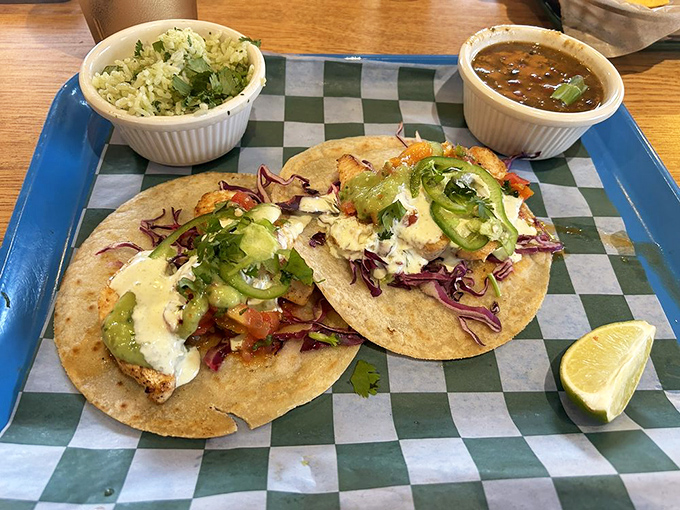 Fish tacos so fresh they might still be telling tales from the sea. Served with cilantro-lime rice and beans, this is vacation on a plate.