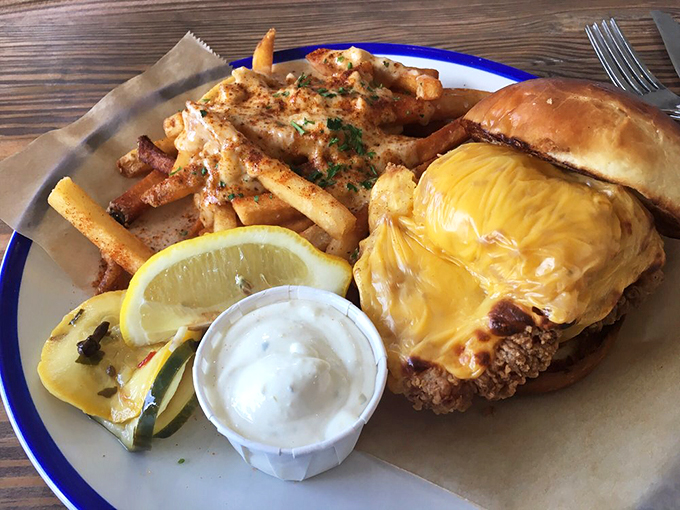 This isn't just a sandwich; it's a golden-fried masterpiece topped with melty cheese that makes you want to write thank-you notes to the ocean.