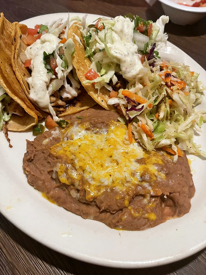 These aren't just fish tacos&mdash;they're edible love letters from the sea, complete with a side of beans that could make a vegetarian weep with joy.