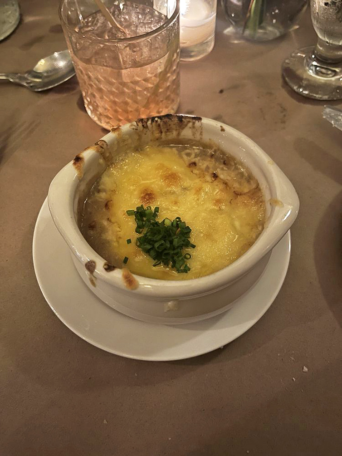 Not just soup, but a bubbling cauldron of comfort crowned with a golden dome of Gruy&egrave;re that stretches with each spoonful.