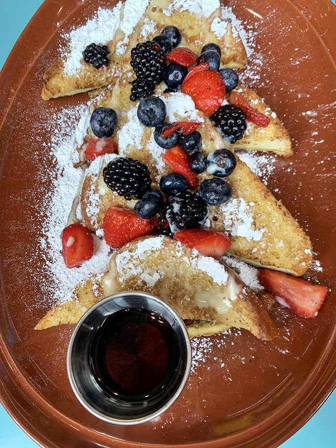 French toast that's dressed for success with a berry-studded crown. That little cup of syrup is just waiting for its moment of glory.
