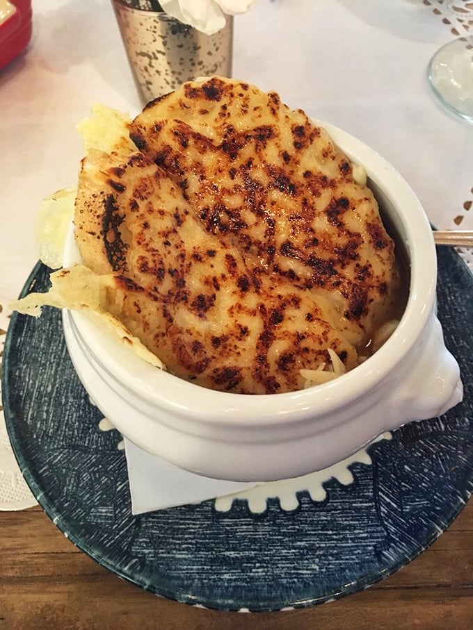 That moment when melted cheese stretches from bowl to spoon like it's auditioning for a food commercial&mdash;French onion soup doesn't get more photogenic than this.