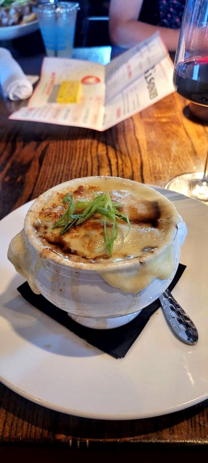 French onion soup that doesn't merely sit in the bowl&mdash;it performs. That cheese pull deserves its own standing ovation and Instagram account.