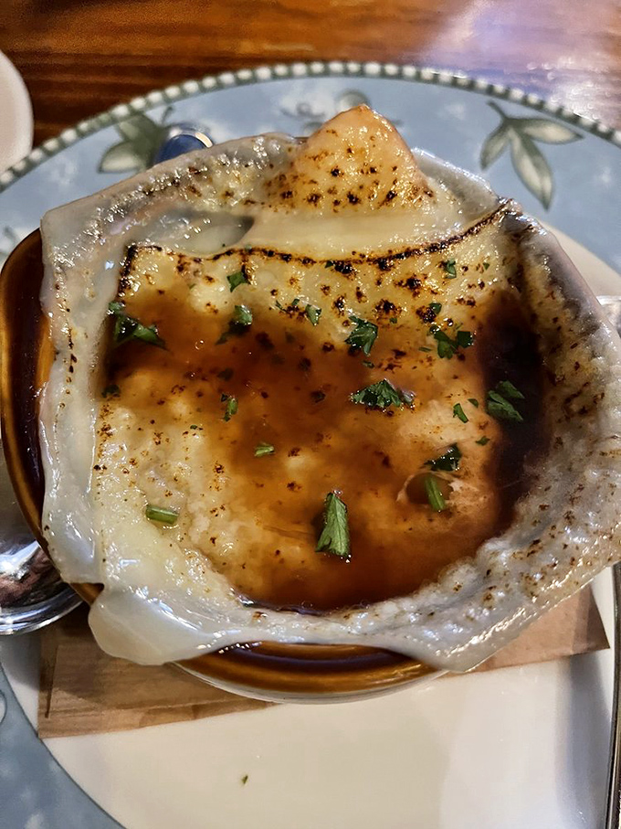 Behold the crown jewel&mdash;French onion soup with a cheese ceiling so perfect, it deserves its own real estate listing.
