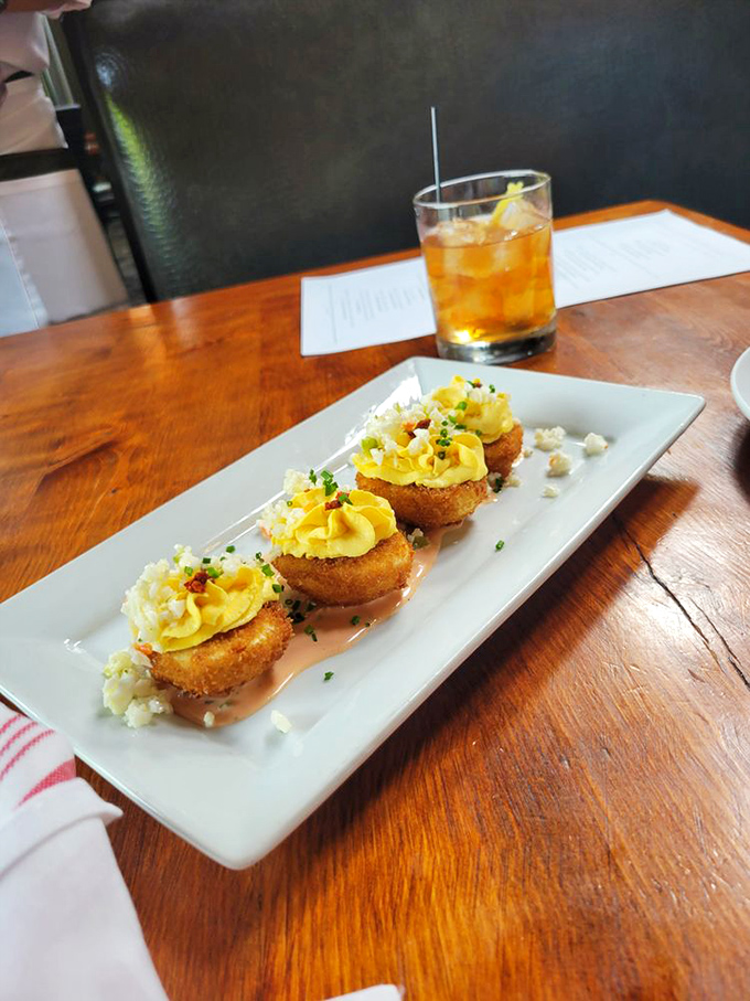 Not your grandmother's deviled eggs! These golden-fried beauties look like they've gone to finishing school and earned honors in deliciousness.