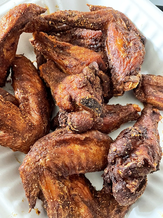 These wings aren't just fried&mdash;they're transformed into crispy, golden-brown vessels of joy that make your fingers worth licking despite what your mother taught you. 