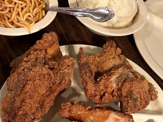 "Golden-brown perfection that makes you forget your table manners. This chicken doesn't need Instagram filters&mdash;it's been camera-ready since before social media existed."
