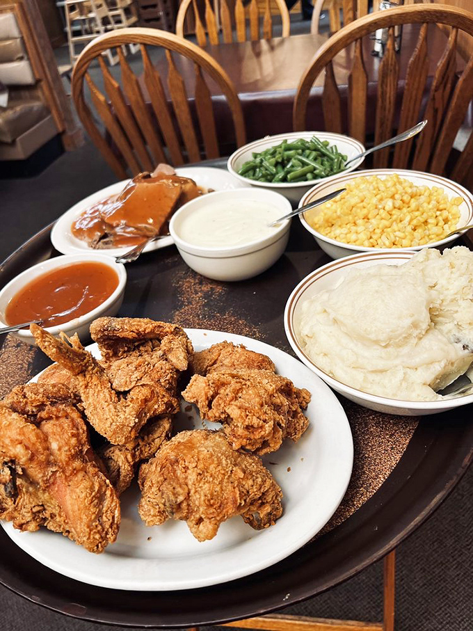 Golden-brown fried chicken sits proudly next to the star of the show&mdash;those famous mashed potatoes. This plate isn't just dinner; it's edible therapy.