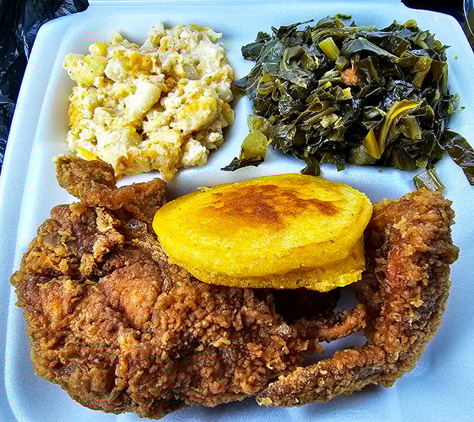 This isn't just fried chicken; it's a Southern symphony of crispy, juicy perfection alongside collards that have clearly simmered in wisdom for hours.