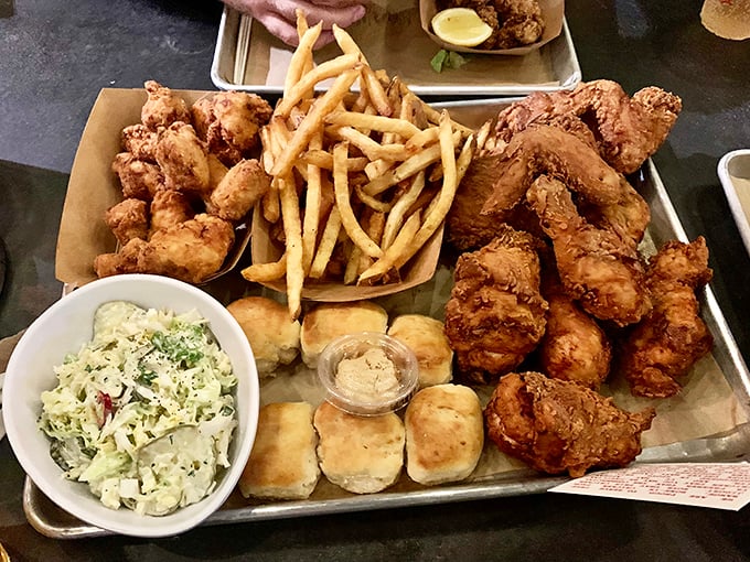 Fried chicken nirvana arrives on a metal tray&mdash;crispy, golden-brown pieces alongside fluffy biscuits and creamy slaw. Diet plans, consider yourselves postponed.