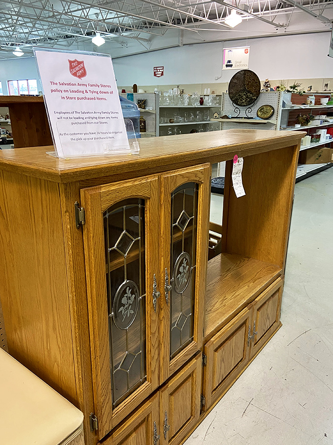 Solid oak entertainment centers with leaded glass doors—relics of the pre-flatscreen era waiting for creative repurposing by imaginative shoppers.