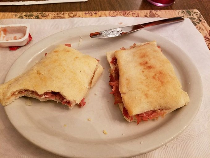 These aren't just ham biscuits; they're edible Virginia history. Golden, flaky vessels delivering salt-cured perfection that would make Thomas Jefferson weep with patriotic joy.