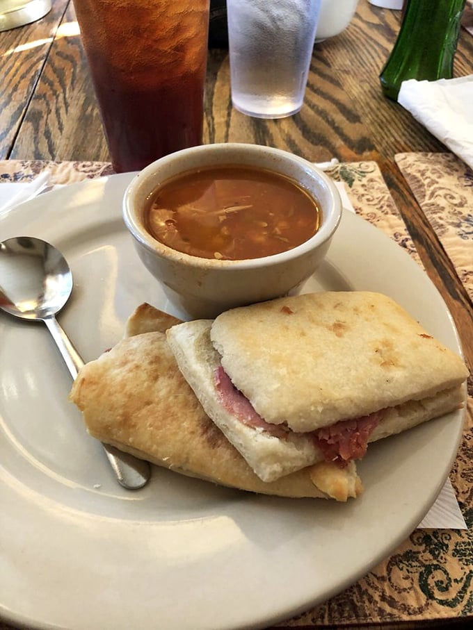 The star of the show arrives! These legendary ham biscuits with a side of Brunswick stew might just be worth crossing state lines for.