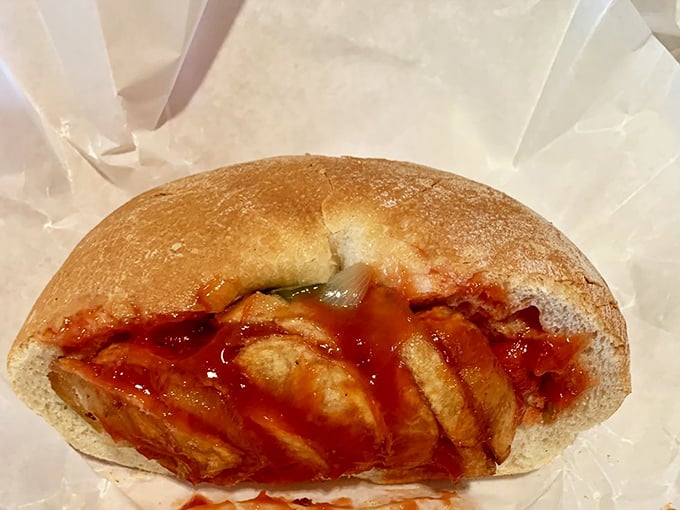 This isn't just a hot dog; it's a masterpiece of edible engineering. The pizza bread cradles its precious cargo like a culinary Sistine Chapel.