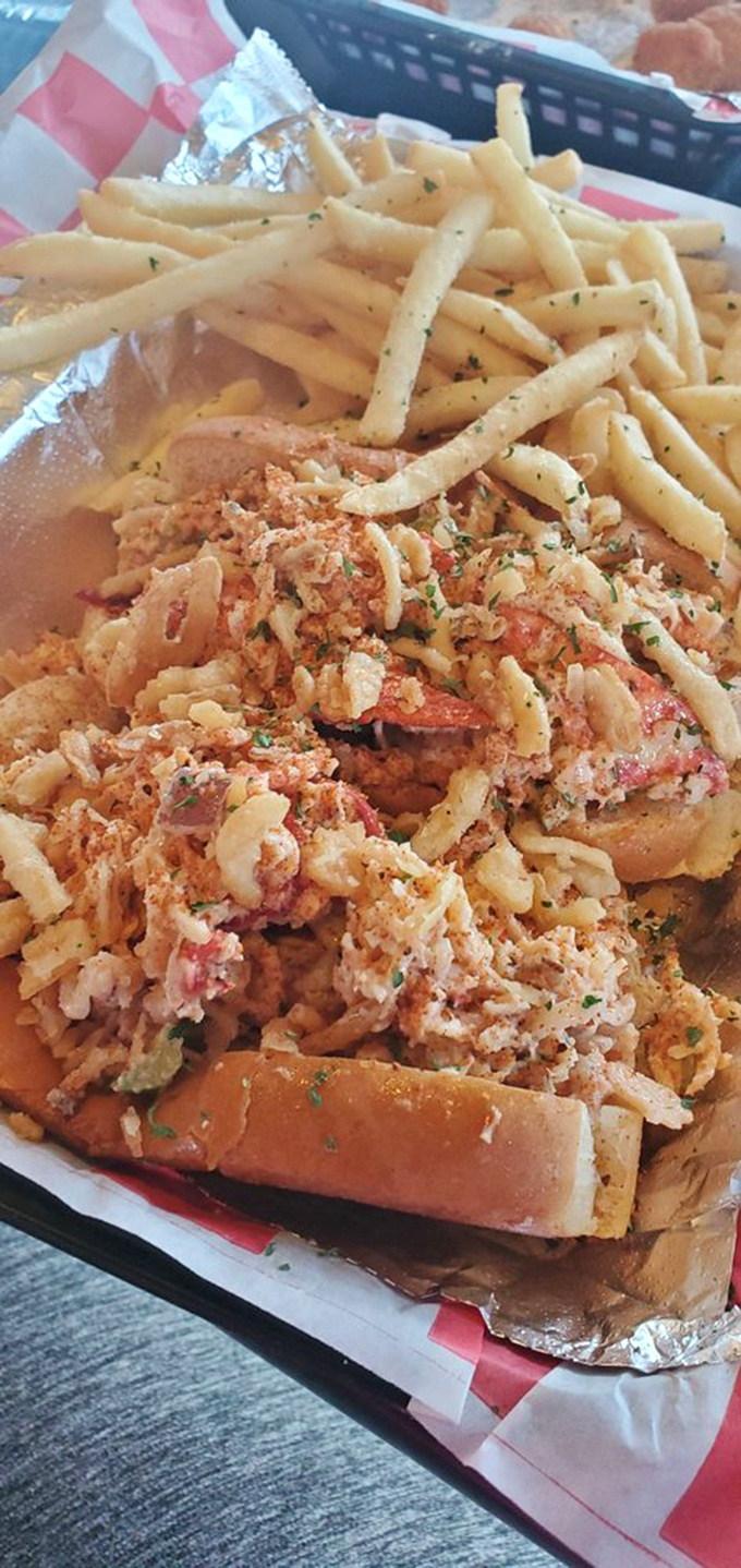 What appears to be seafood perfection – chunks of delicate meat nestled alongside crispy fries. The ocean's finest treasure on a bun.