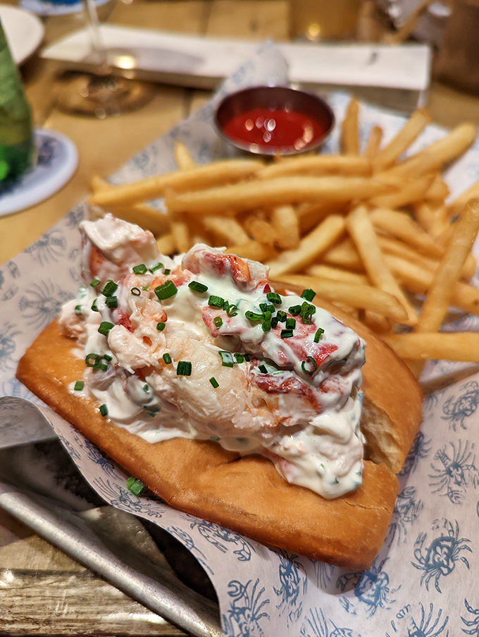 The Maine-style lobster roll arrives like a celebrity&mdash;chunks of sweet lobster dressed in mayo, garnished with chives, and accompanied by golden fries.