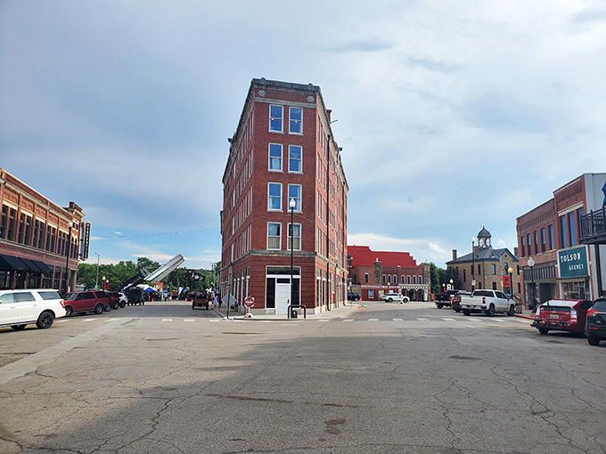 The Triangle Building anchors downtown Pawhuska like a red-brick ship's prow, navigating the intersection of history and small-town revival.
