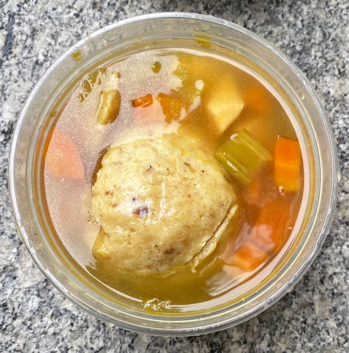 Liquid gold cradles a perfect matzo ball like a planet in its own delicious solar system. This soup doesn't just warm your body&mdash;it hugs your soul.