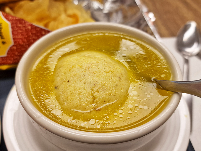 Behold the golden elixir of life itself&mdash;chicken soup with a matzo ball so perfect it could float in zero gravity.