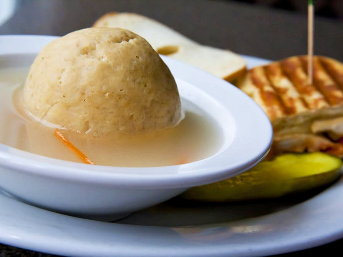 Behold the matzo ball soup in all its glory&mdash;a perfect sphere of comfort floating in liquid gold that could cure anything from a cold to existential dread.