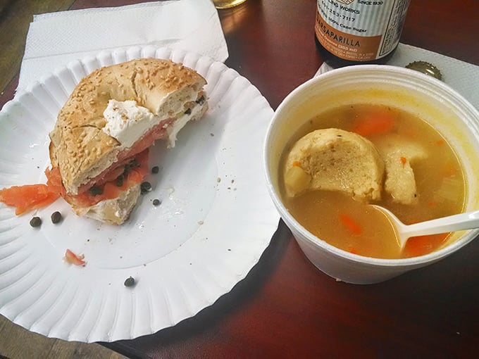 A perfect marriage: golden matzo ball soup alongside a bagel sandwich with lox. Like comfort and luxury decided to share a plate.