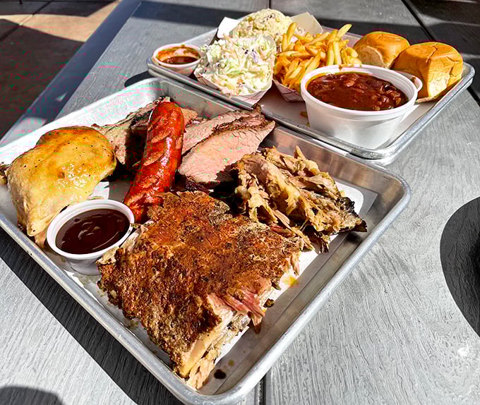 Meat paradise found! This tray of barbecue bounty features perfectly smoked meats alongside classic sides, proving that happiness can indeed be served on a metal tray.
