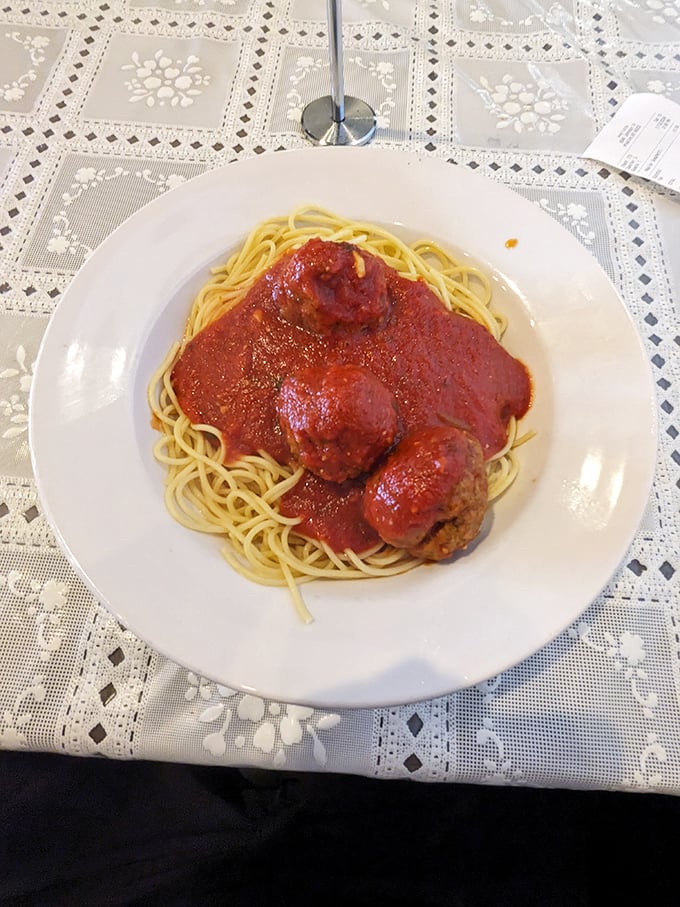 Behold, the holy trinity of comfort food: perfectly cooked spaghetti, robust marinara, and meatballs so tender they practically surrender to your fork.