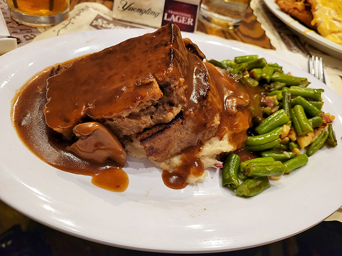 This meatloaf isn't just comfort food; it's a therapy session on a plate, complete with green beans that actually make vegetables exciting.