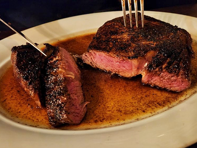 Behold the star of the show: a perfectly seared medium-rare ribeye that would make vegetarians question their life choices.