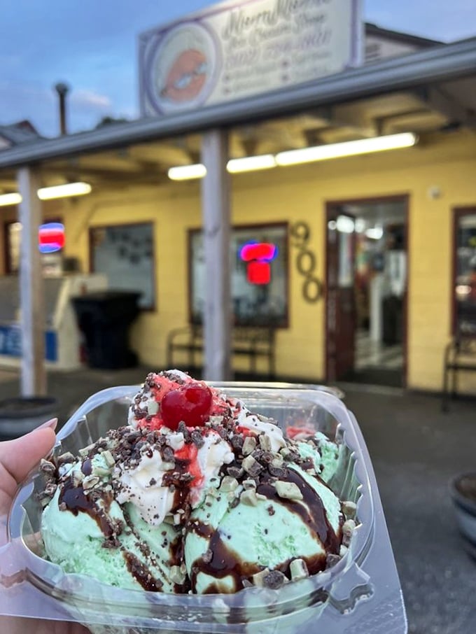 Mint perfection topped with chocolate shavings and a cherry on top. This isn't just dessert—it's edible architecture with a view.